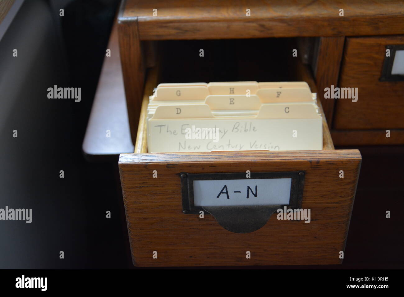 A handwritten antique person library paper and wooden card catalog ...