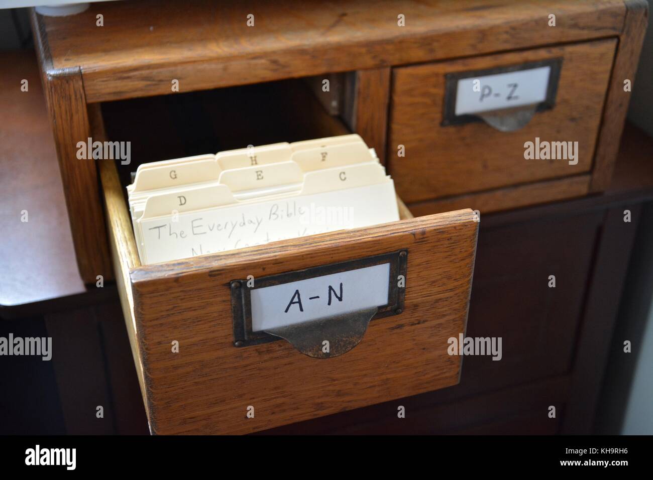 A handwritten antique person library paper and wooden card catalog ...