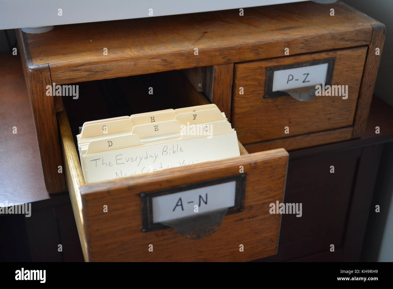 A handwritten antique person library paper and wooden card catalog ...