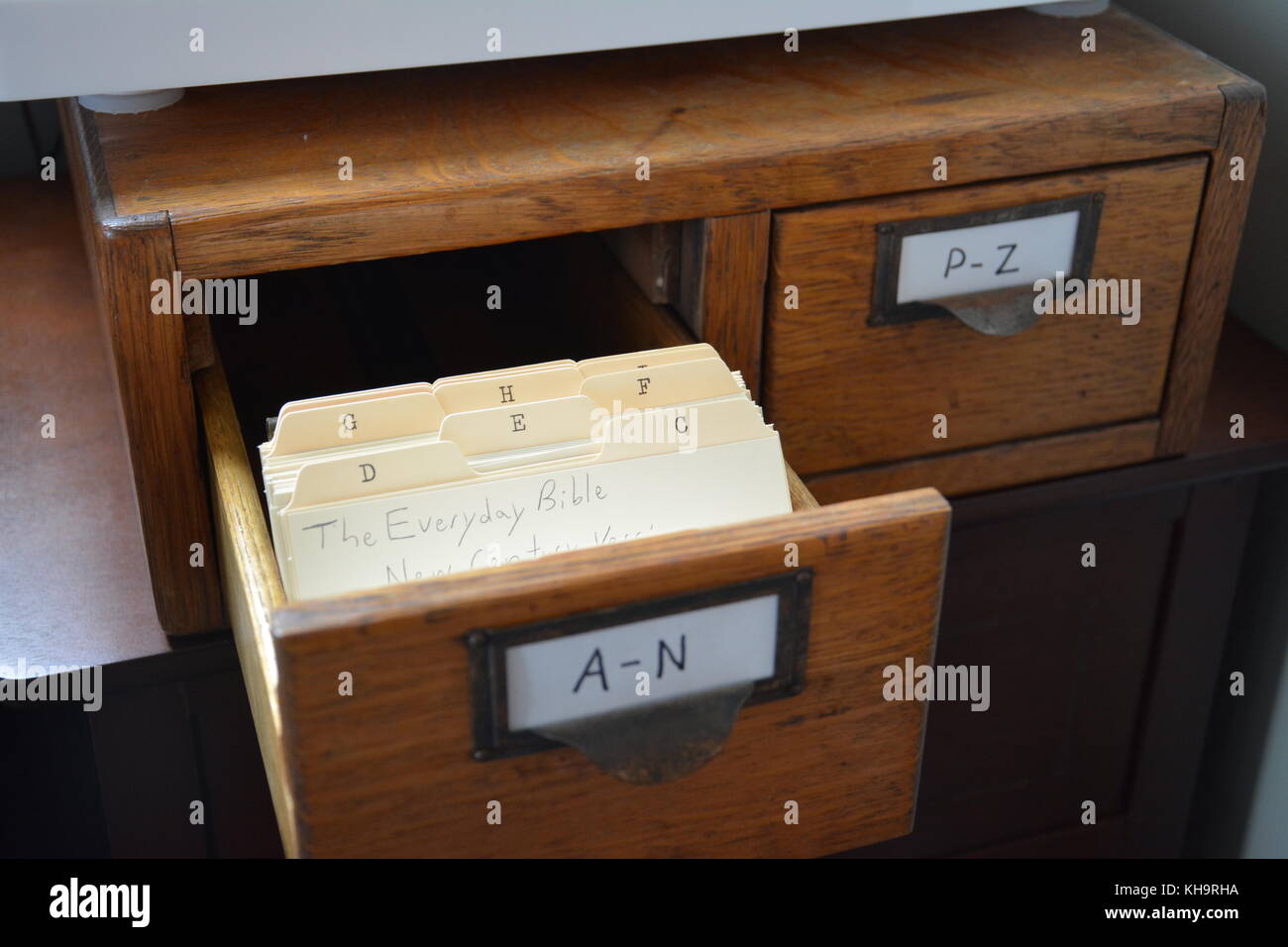 A handwritten antique person library paper and wooden card catalog ...