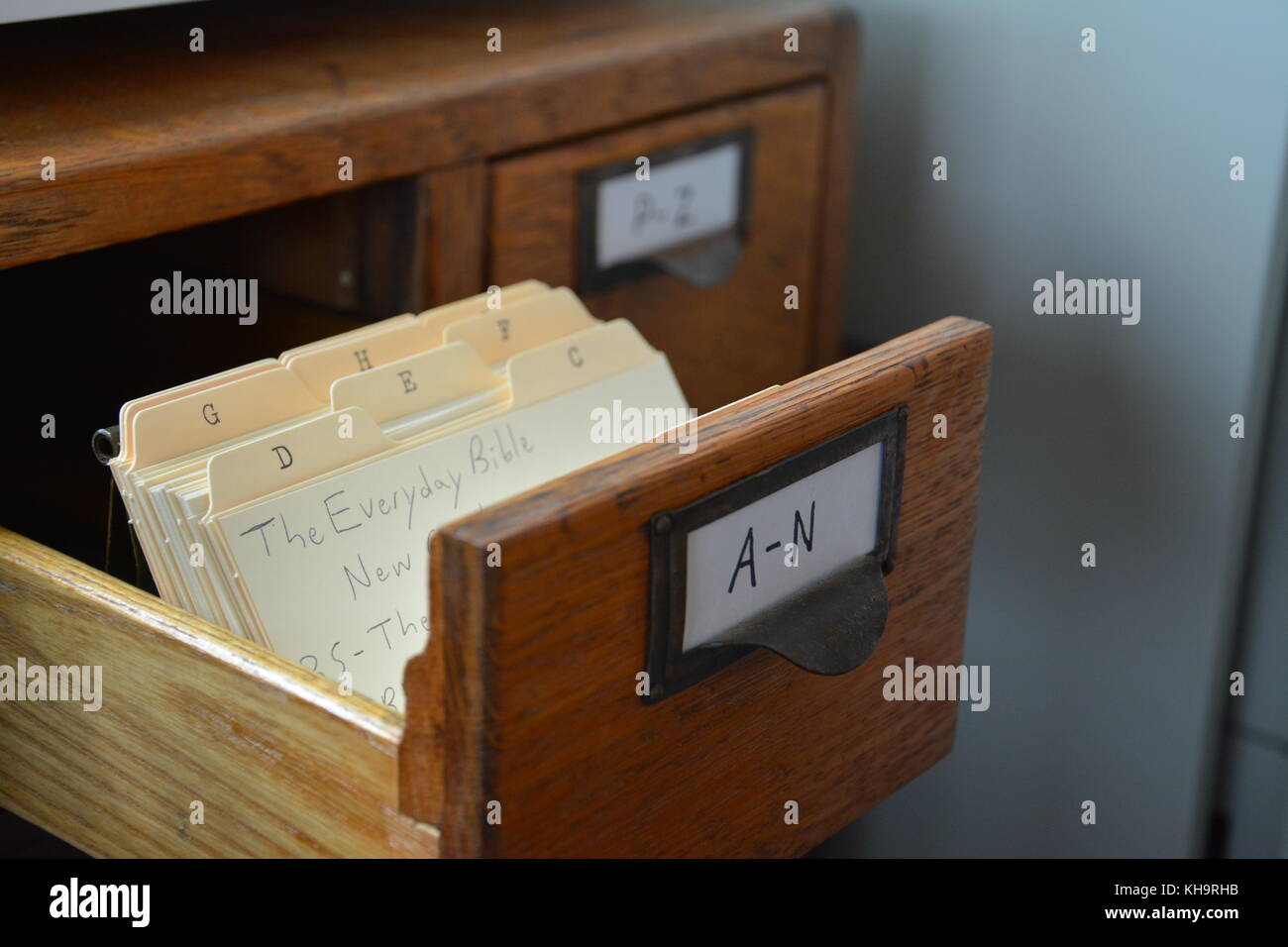 A handwritten antique person library paper and wooden card catalog ...