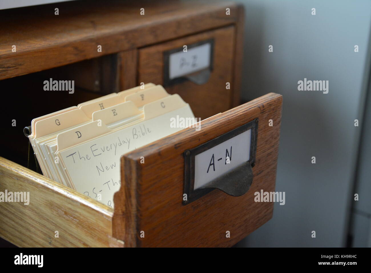 A handwritten antique person library paper and wooden card catalog ...