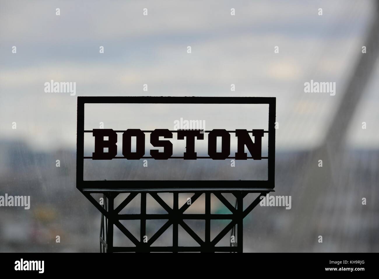 A "Boston" billboard sign macro shot with the Boston cityscape behind ...