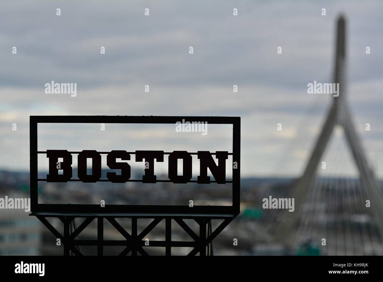 A "Boston" billboard sign macro shot with the Boston cityscape behind ...