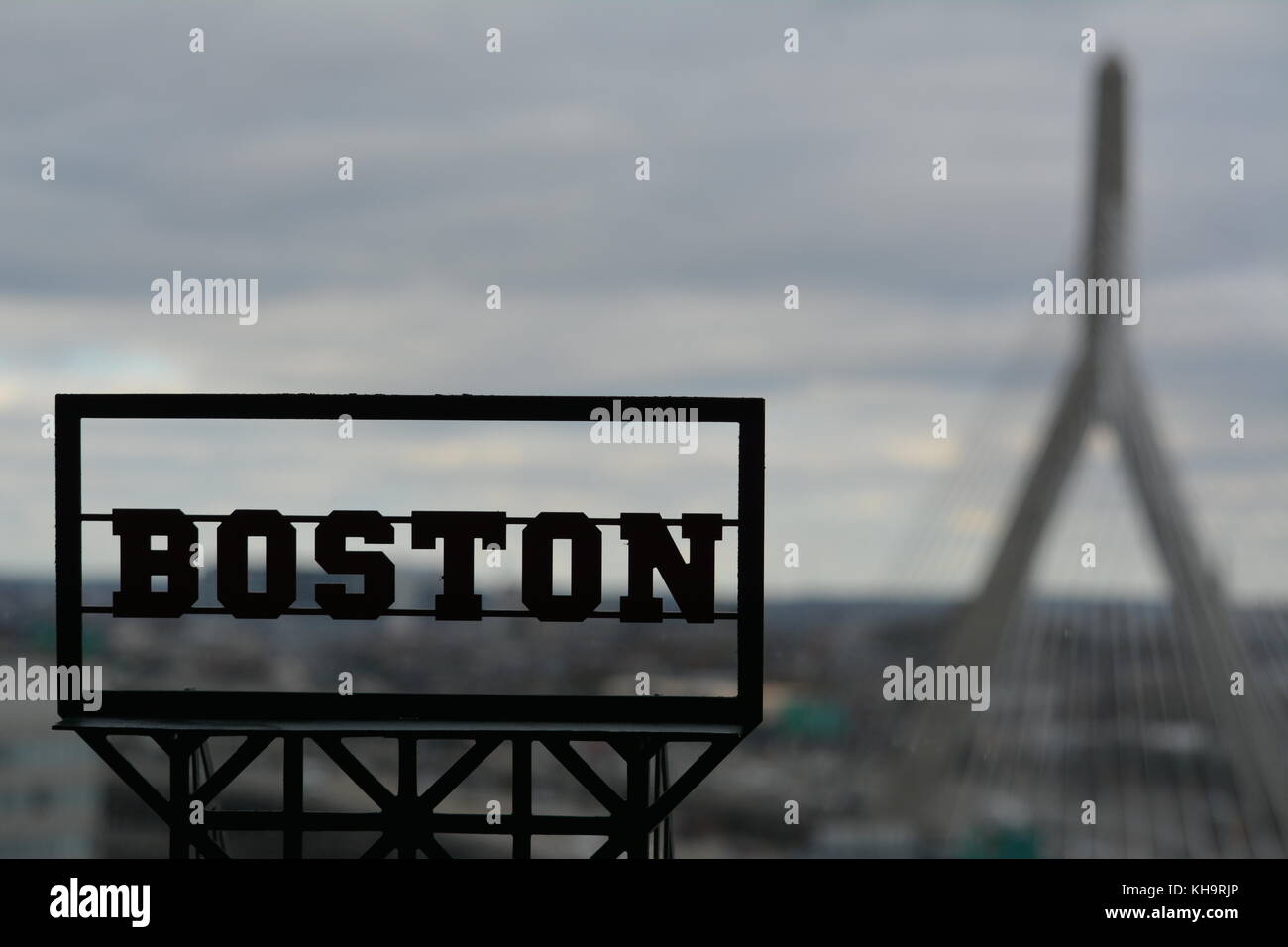 A "Boston" billboard sign macro shot with the Boston cityscape behind ...