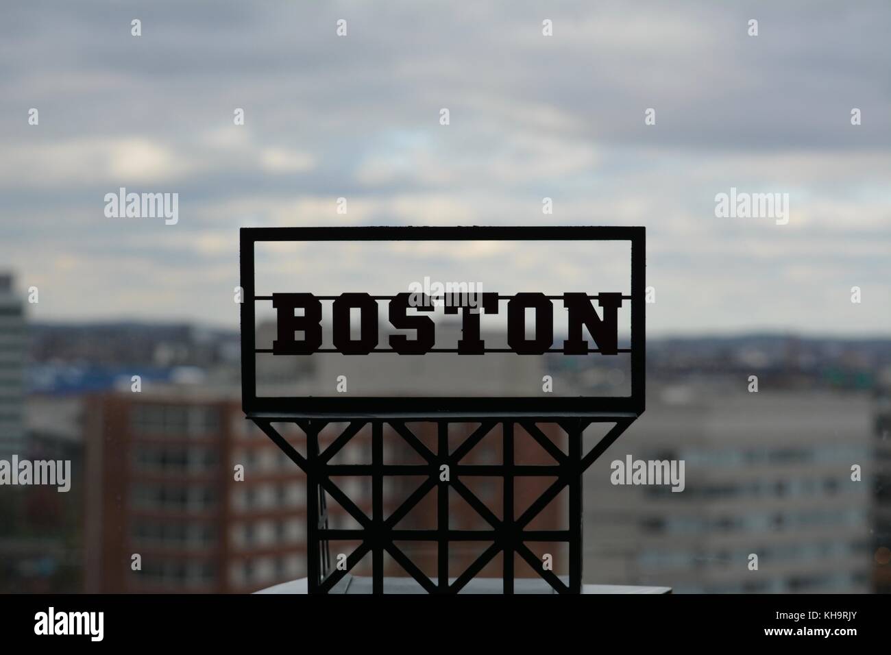 A "Boston" billboard sign macro shot with the Boston cityscape behind ...