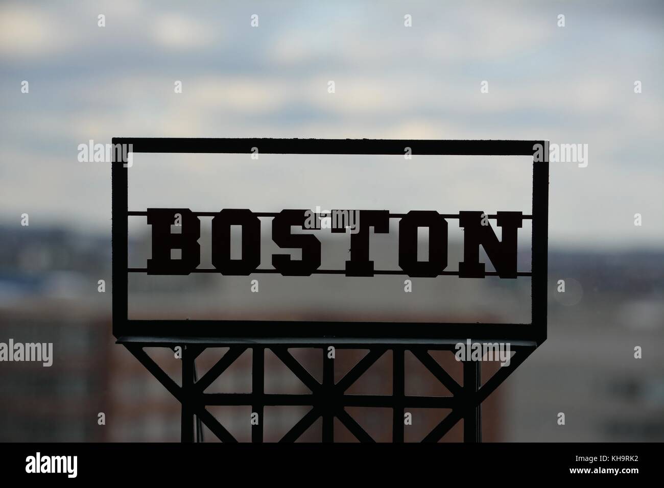 A "Boston" billboard sign macro shot with the Boston cityscape behind ...