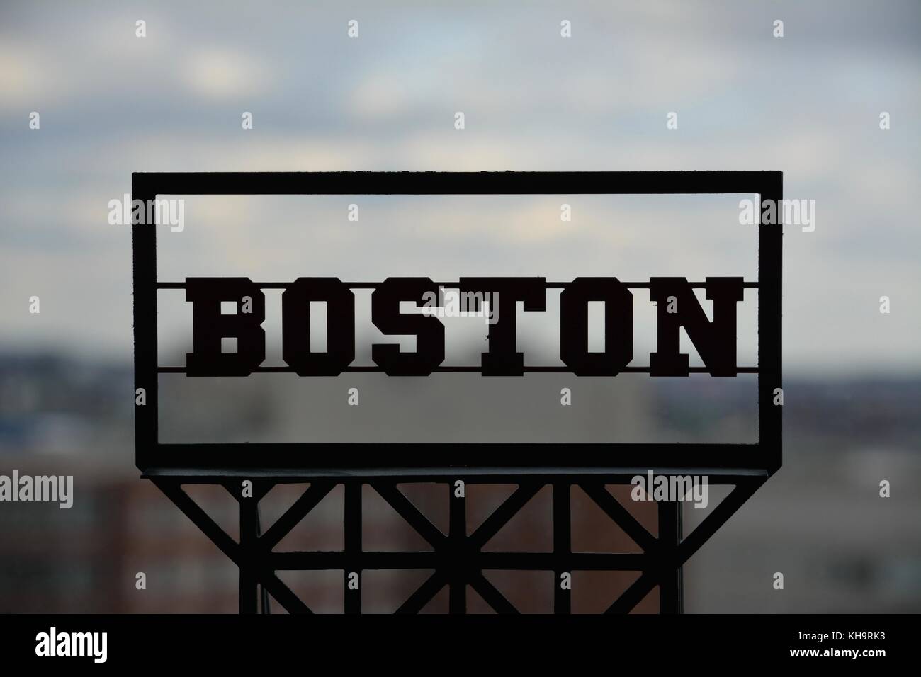 A "Boston" billboard sign macro shot with the Boston cityscape behind ...