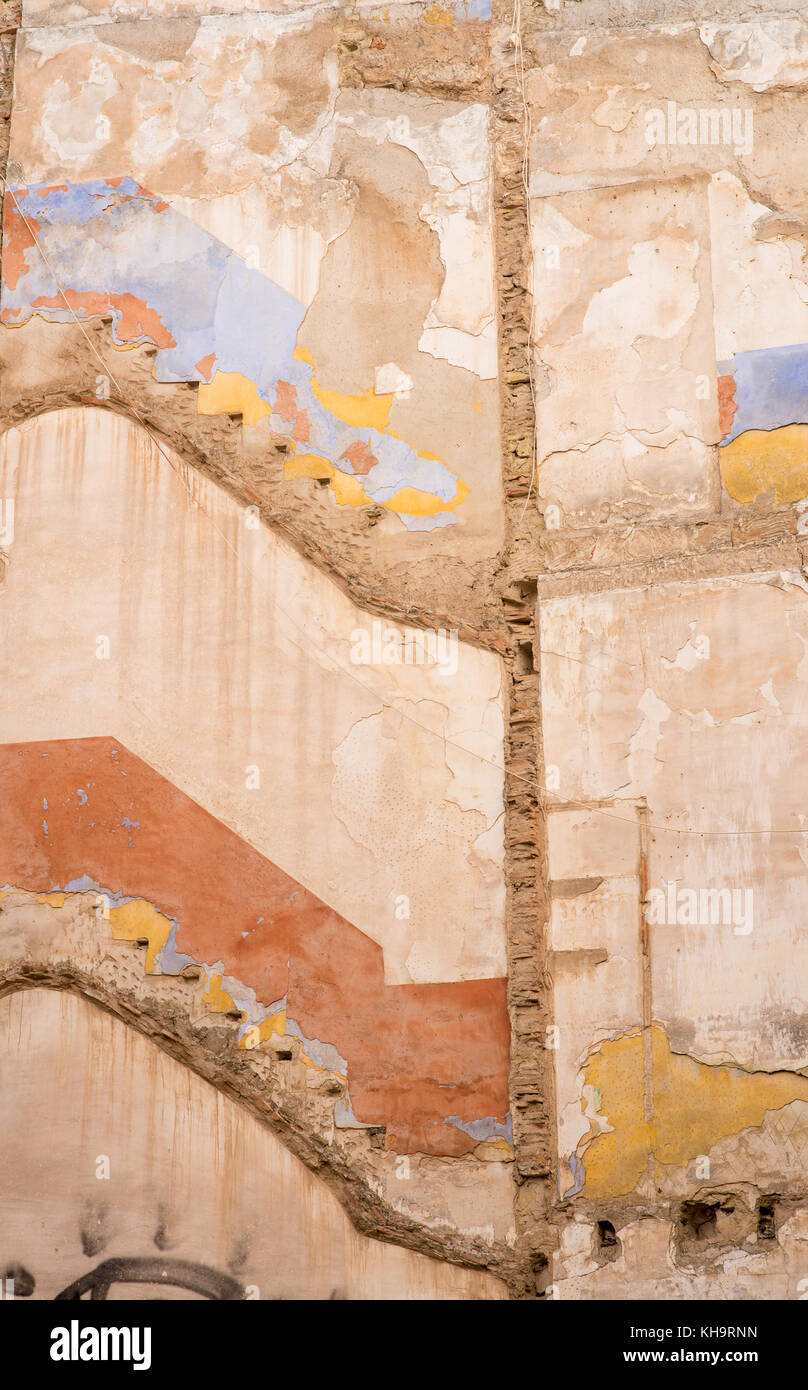 Old wall of a ruined building displaying several colours and textures ...