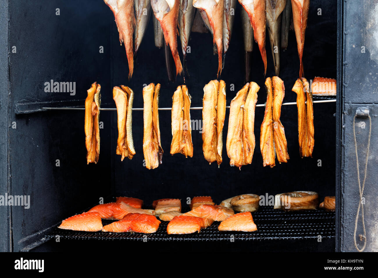 Smoked fish hanging in a smokehouse Stock Photo - Alamy
