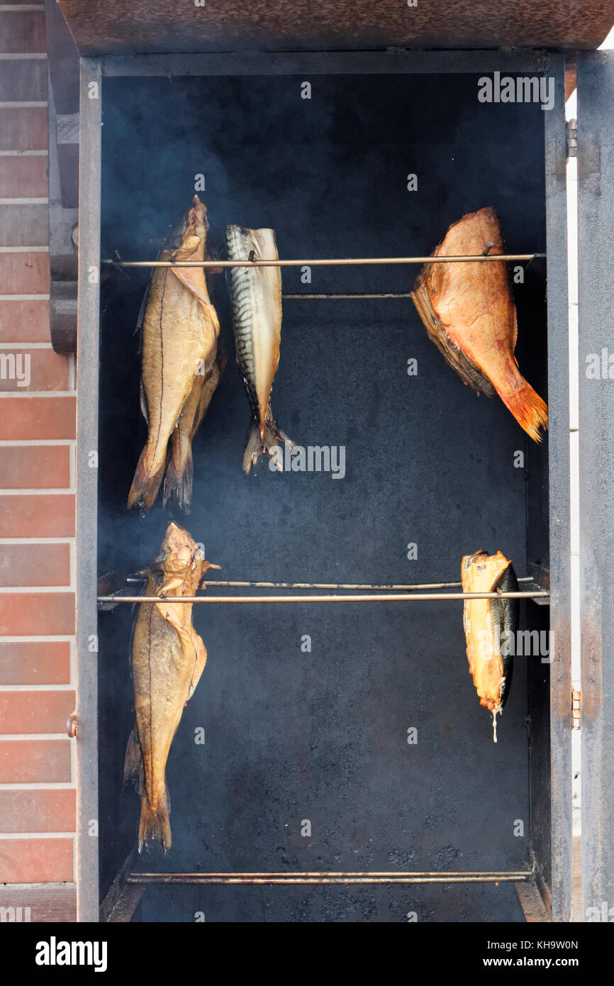 Smoked fish hanging in a smokehouse Stock Photo - Alamy