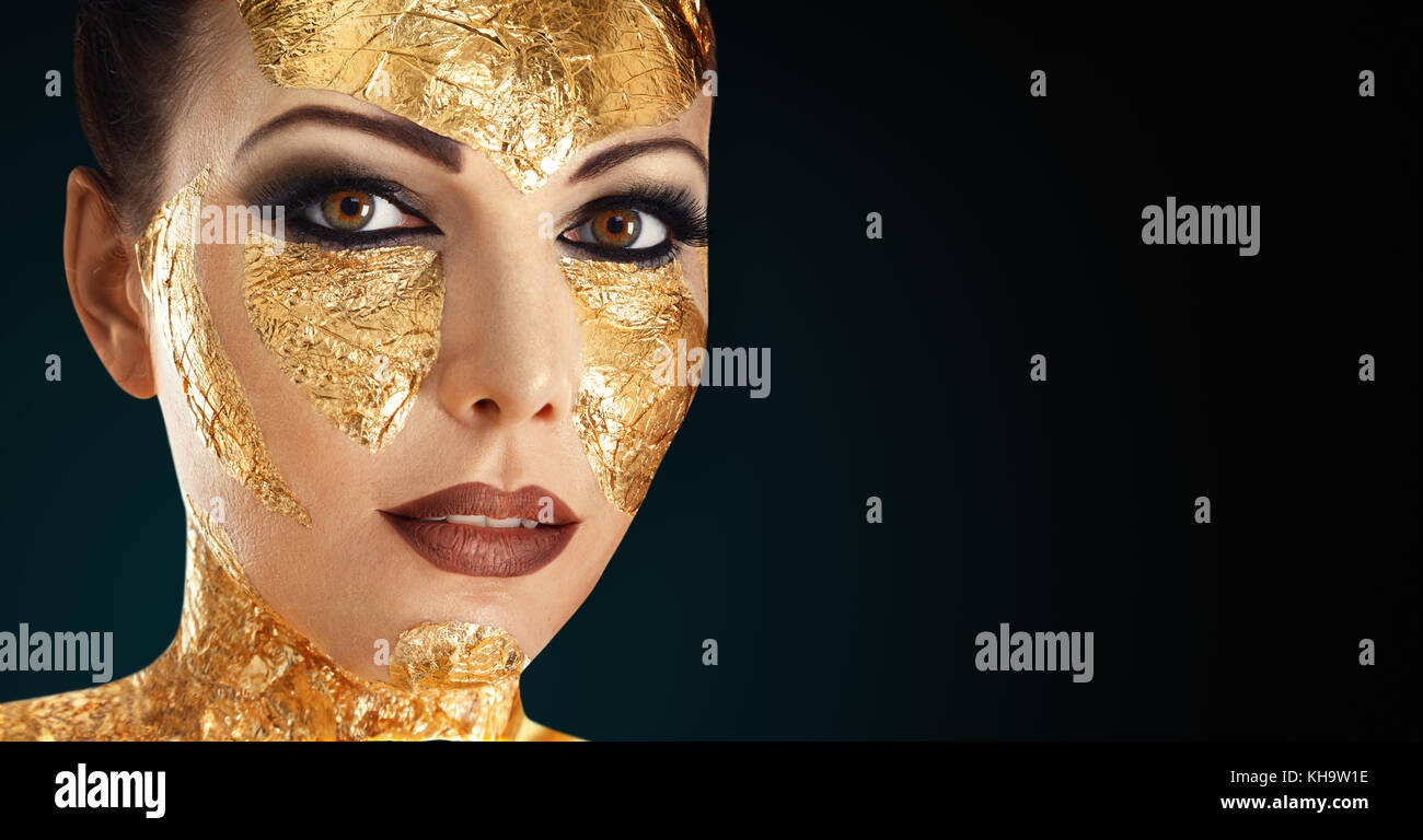 Woman with gold mask hi-res stock photography and images - Alamy