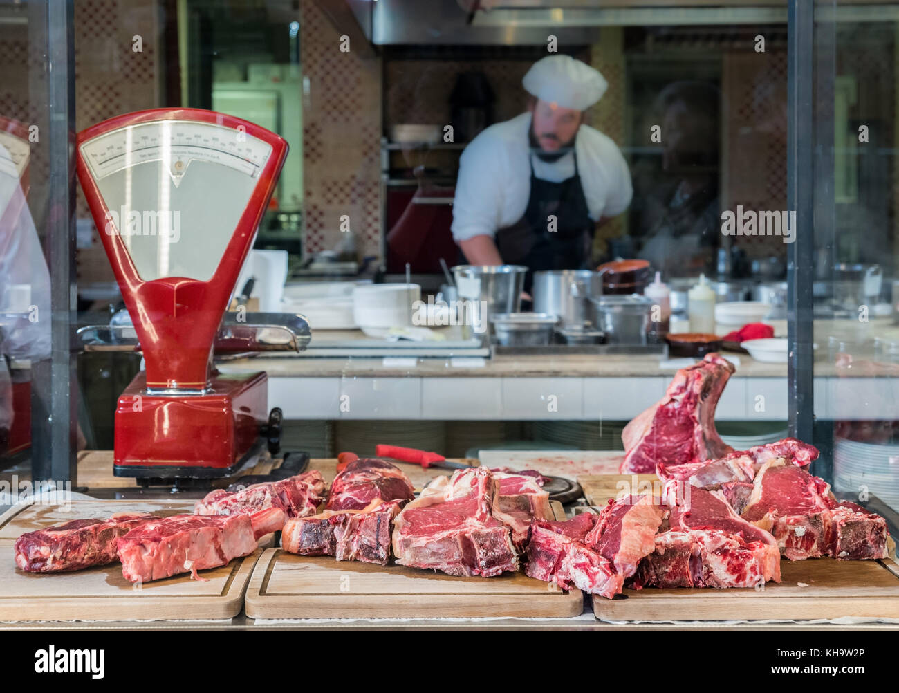 Raw red meat on a cutting board next to scales - captured in Florence ...