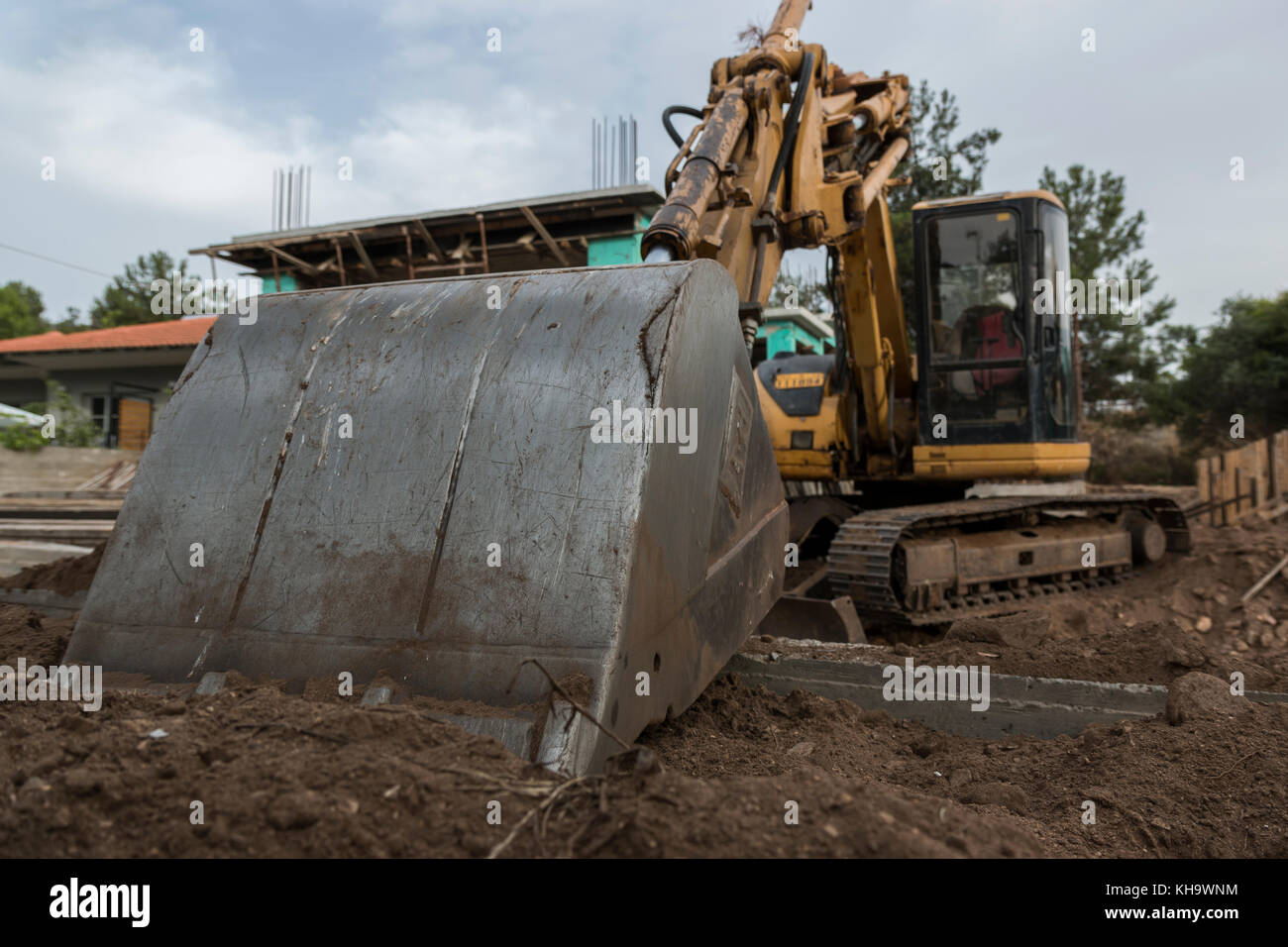 Excavator on construction site Stock Photo - Alamy