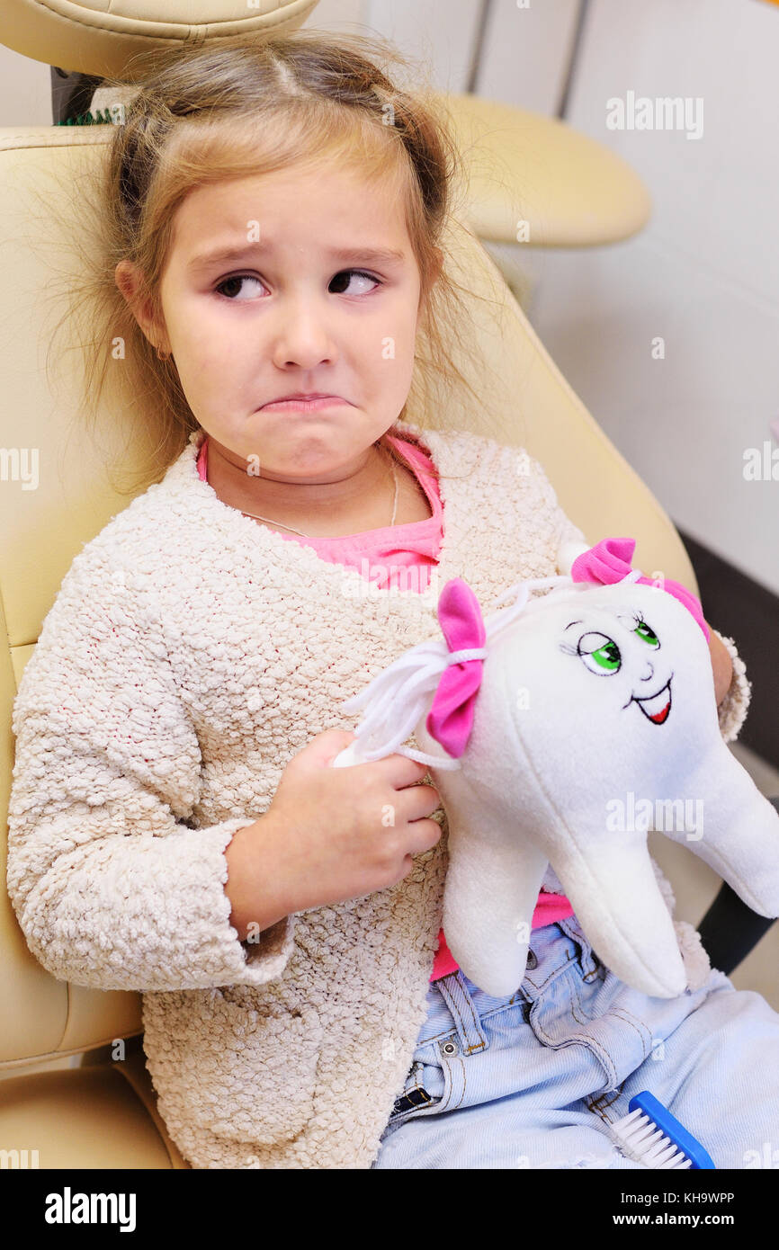 baby girl crying in the dental chair Stock Photo - Alamy