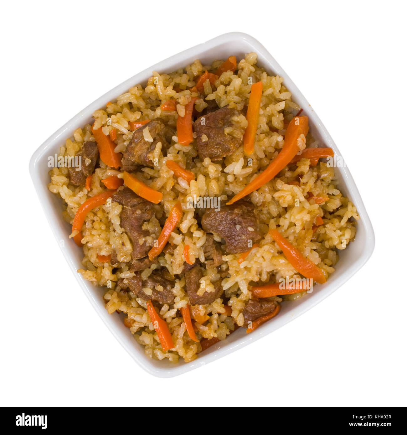 pilaf in a white plate isolated on white background Stock Photo - Alamy
