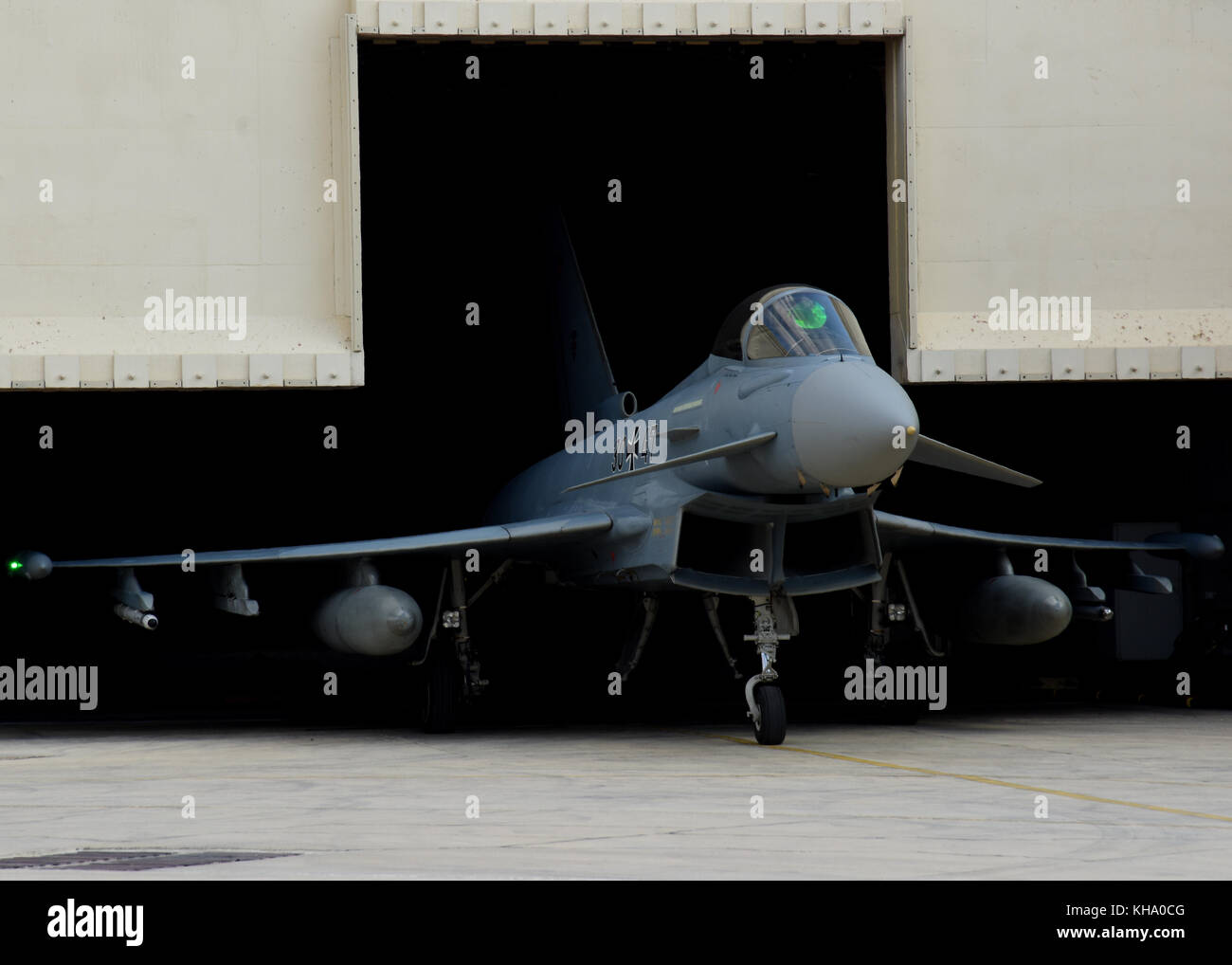 A German Eurofighter Typhoon taxis out of a hardened shelter to begin ...