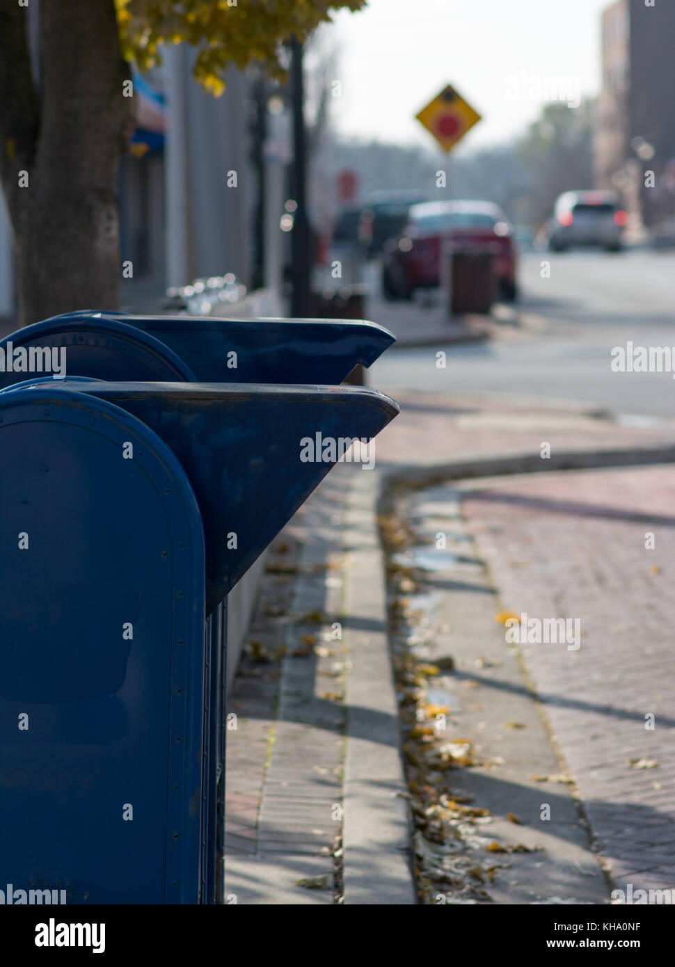 blue mail box sitting curbside for drive up drop off Stock Photo - Alamy