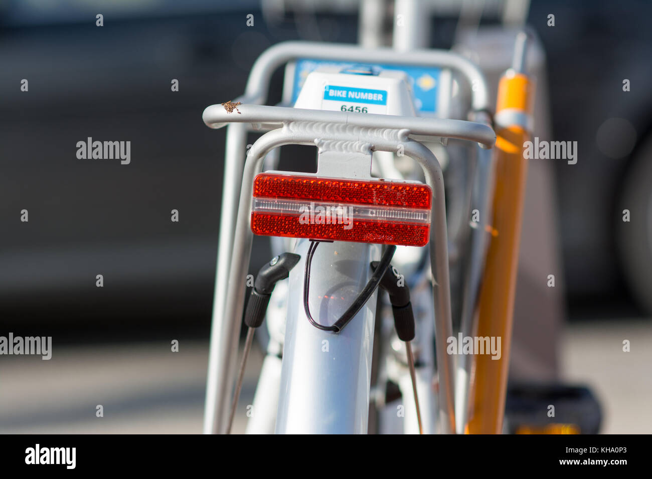 rear reflector from a white rental bike Stock Photo - Alamy