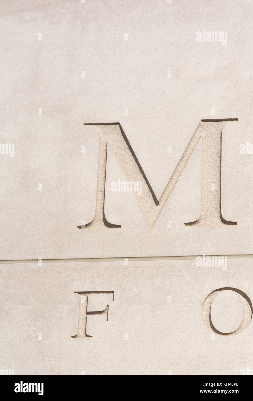 letters engraved into stone building Stock Photo - Alamy