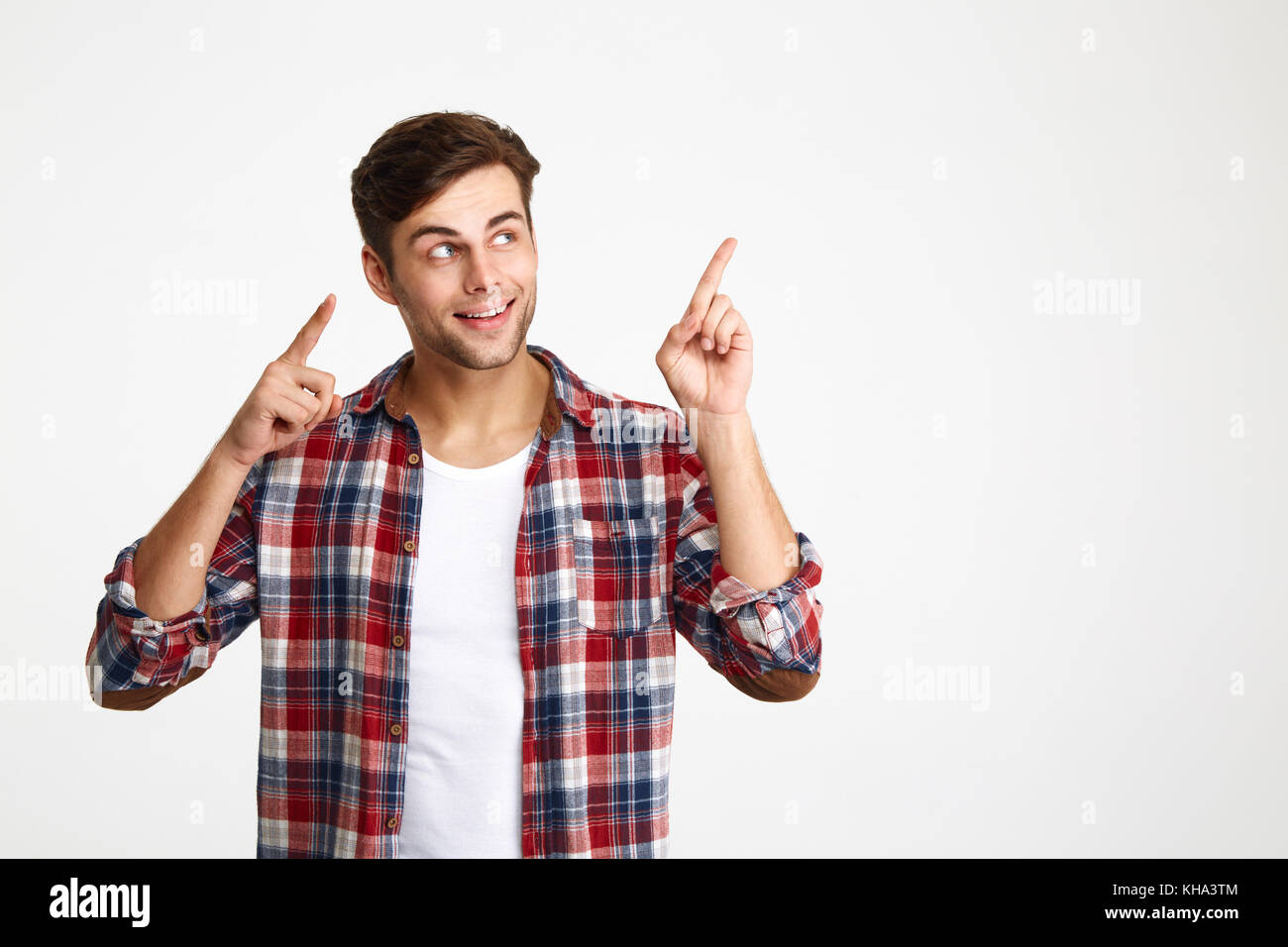 Close-up photo of happy attractive young man in checkered shirt ...