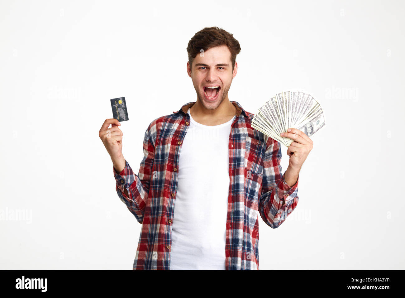 Portrait of a happy excited man holding bunch of money banknotes with a ...