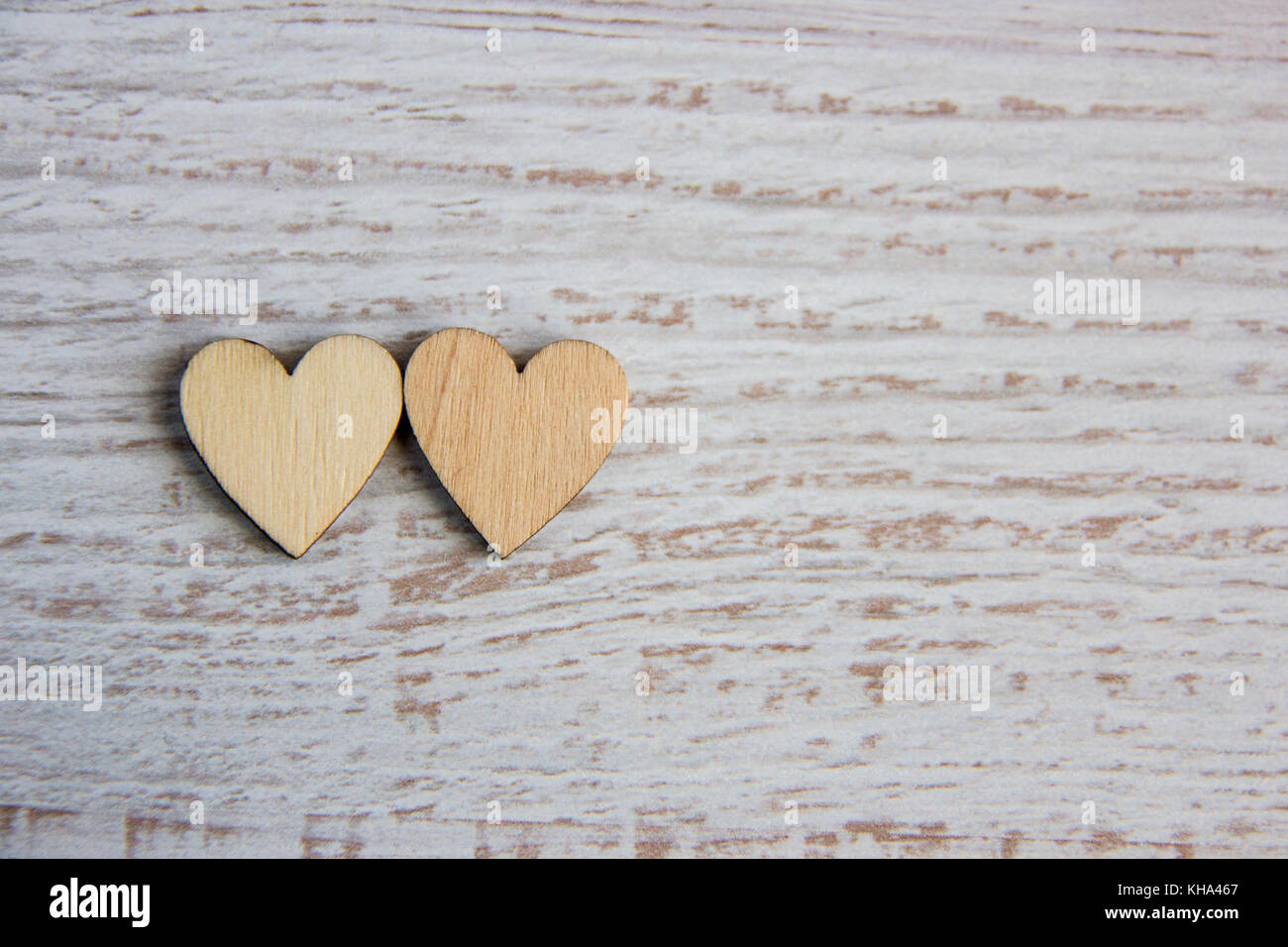 Heart shape from natural tree wooden small hearts on rustic wood table ...