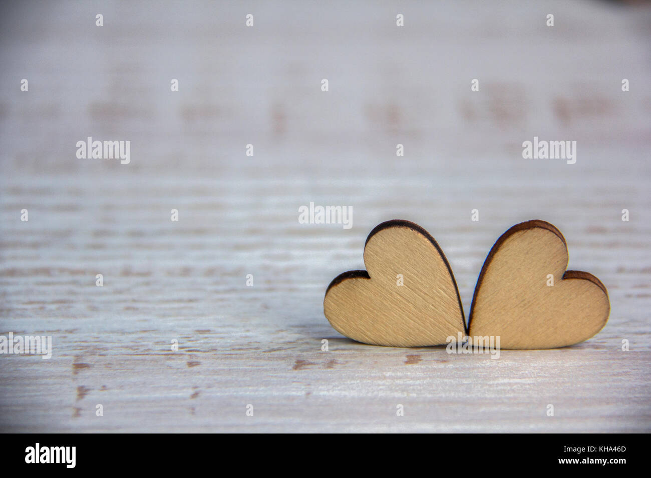 Heart shape from natural tree wooden small hearts on rustic wood table ...
