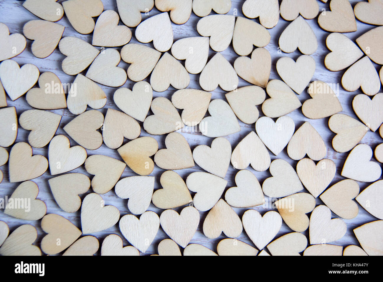 Heart shape from natural tree wooden small hearts on rustic wood table ...