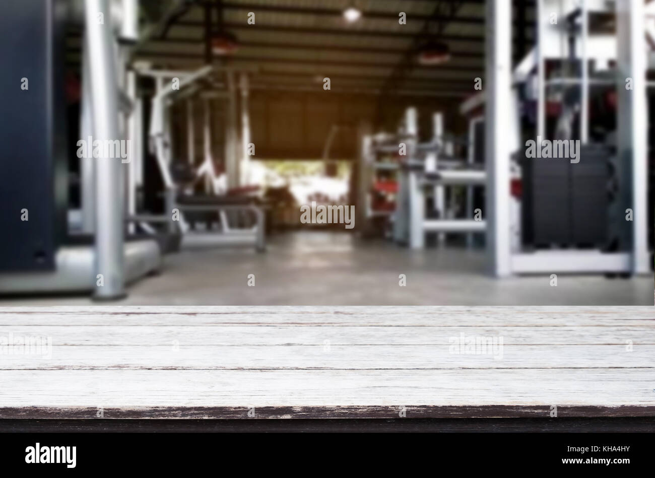Wooden table on blurred background of fitness gym interior of modern ...