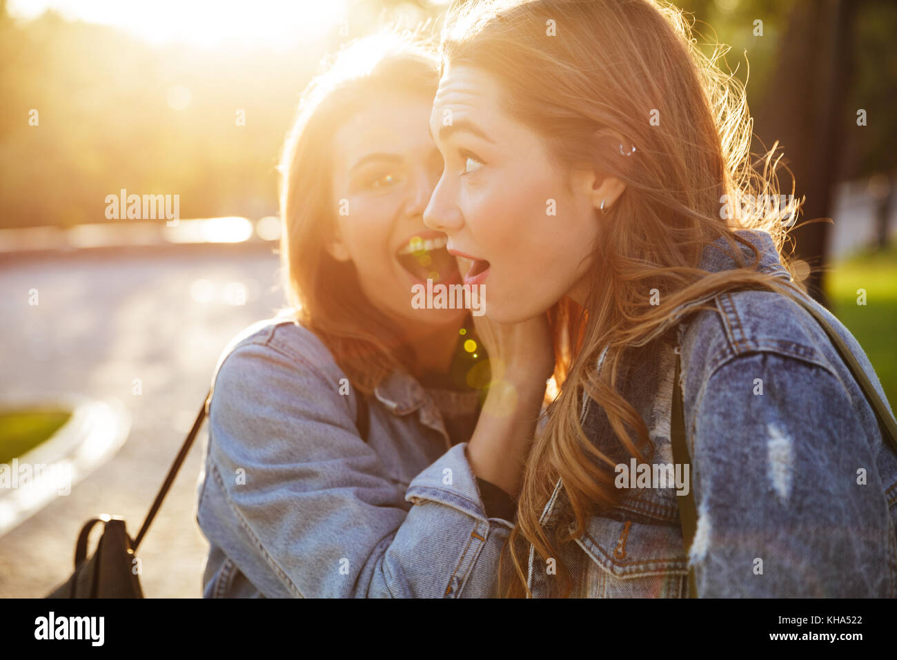 Telling a secret hi-res stock photography and images - Alamy