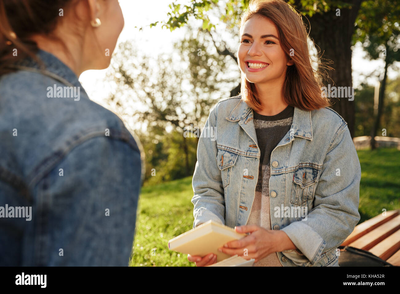 Girls discussing book hi-res stock photography and images - Alamy