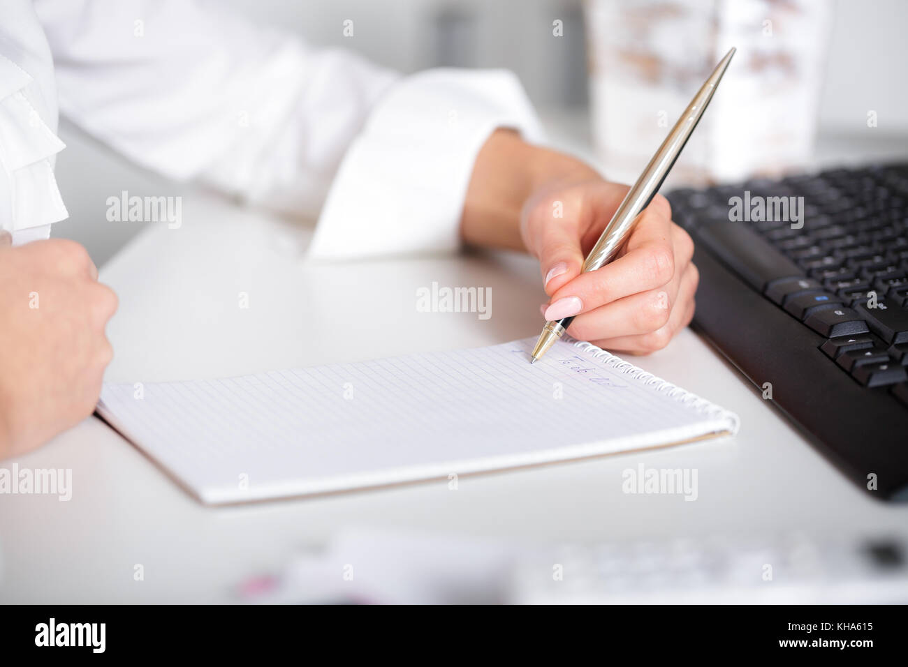 business woman hand writing on paper Stock Photo - Alamy