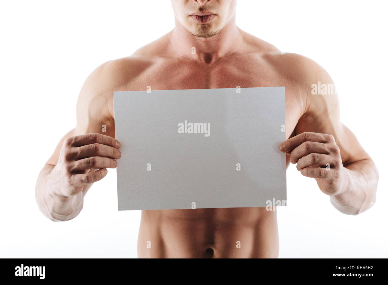 Cropped photo of strong handsome young sportsman standing isolated over ...