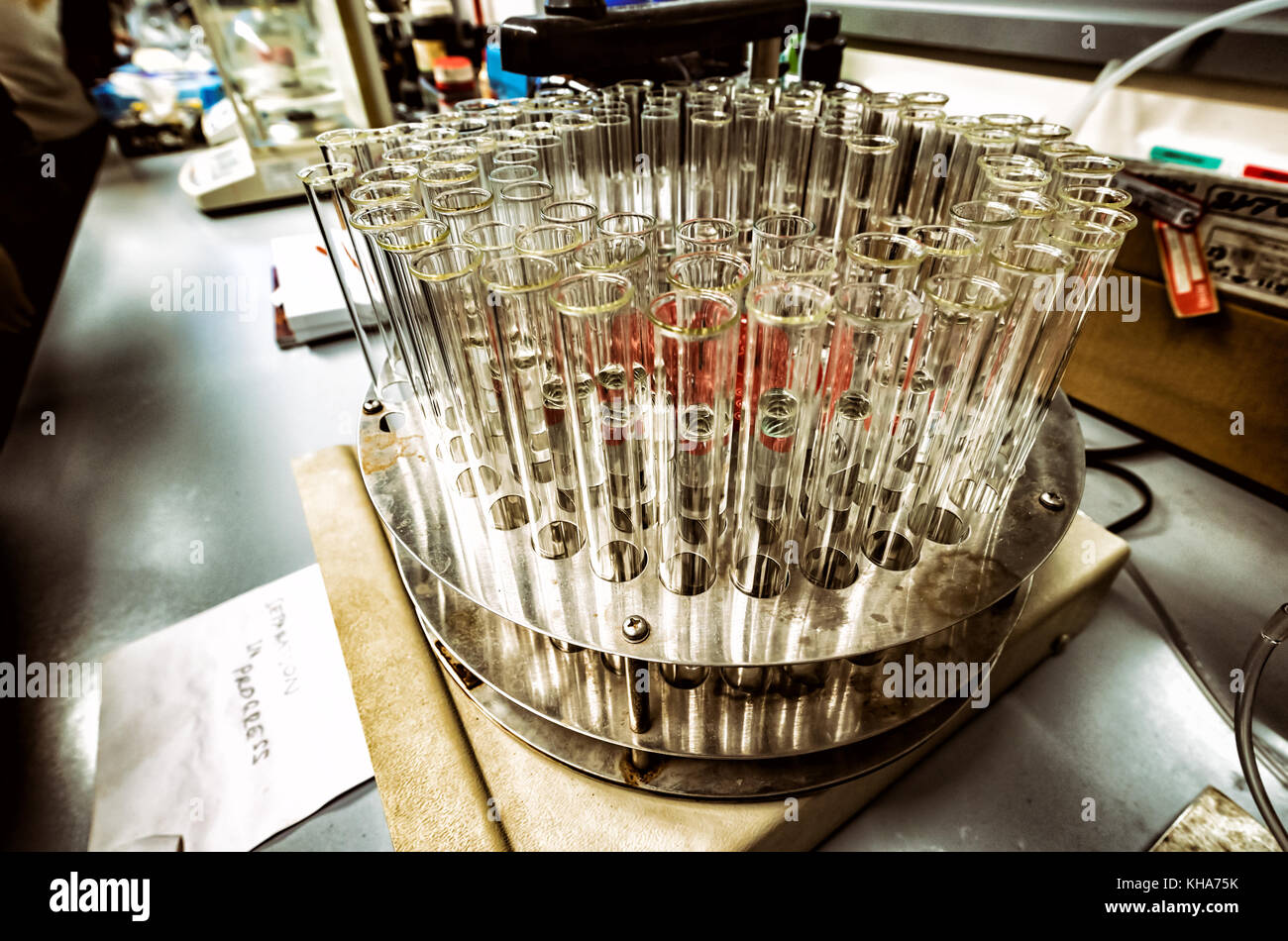 Test tubes in stand background Stock Photo - Alamy