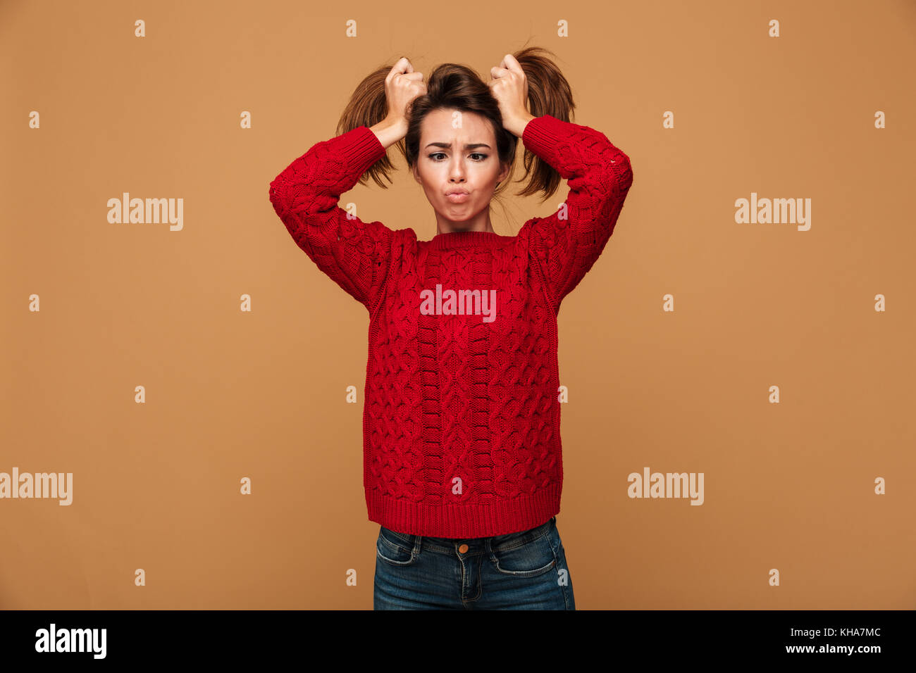 Image of pretty caucasian woman dressed in sweater standing isolated ...