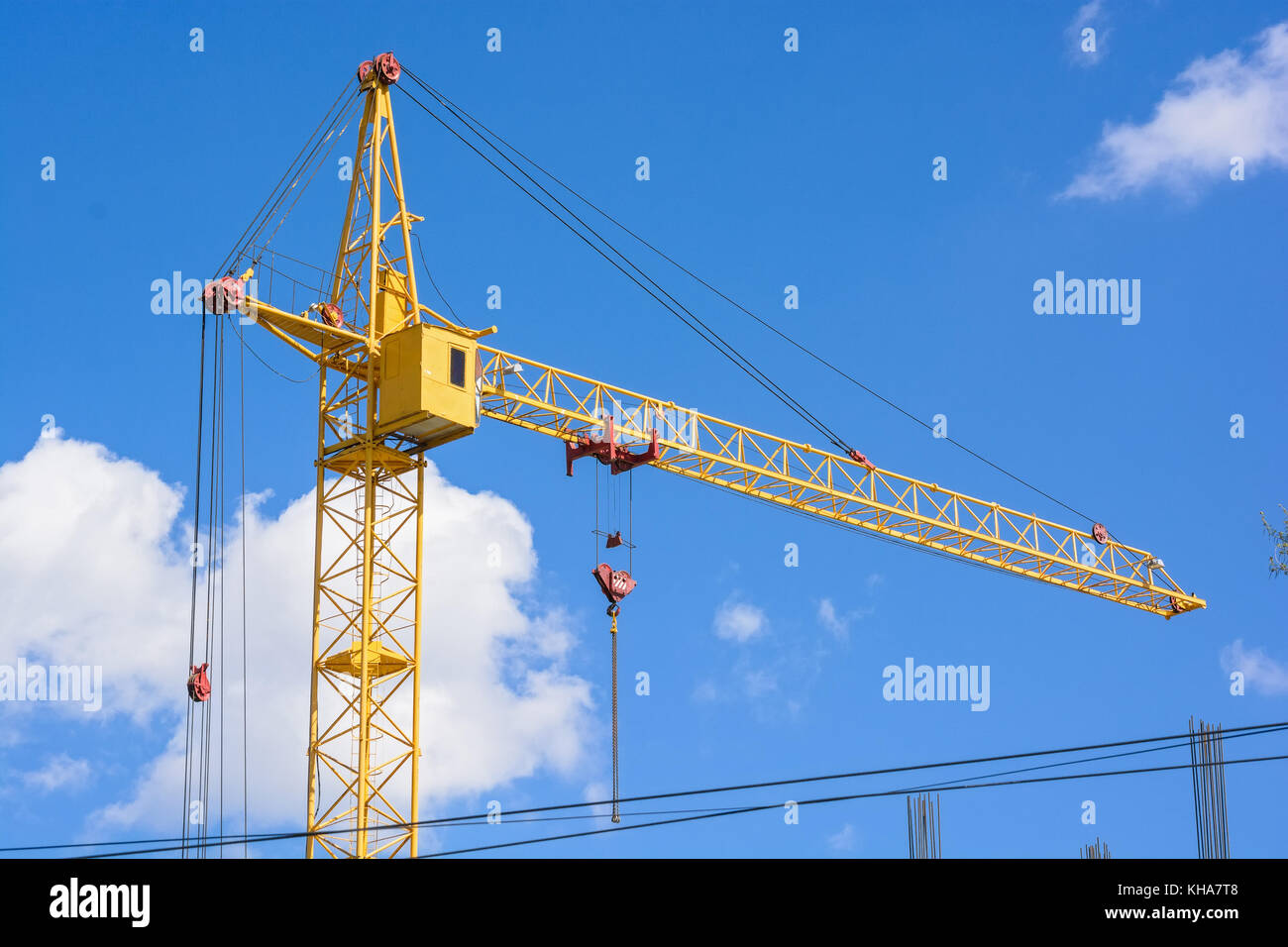 Construction crane builds new building Stock Photo - Alamy