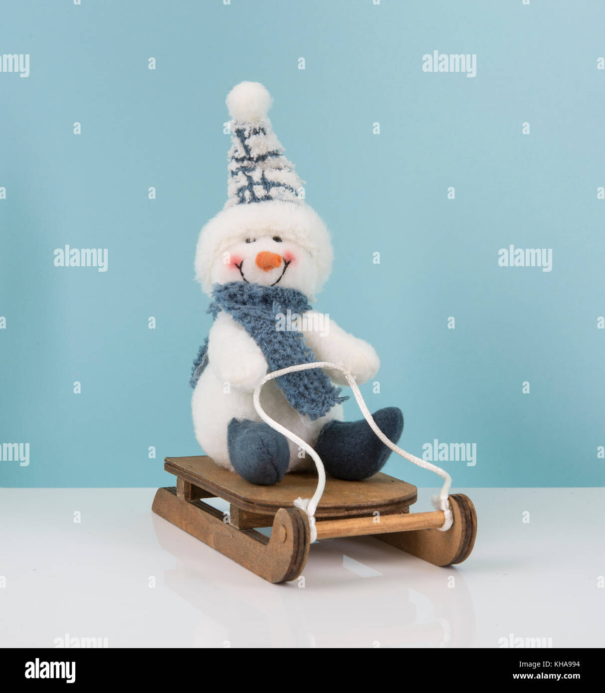 Snowman on a sledge Stock Photo - Alamy