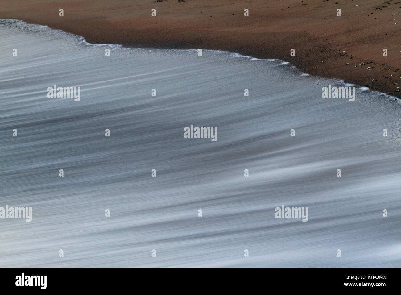 France, wave flushing back on the beach Stock Photo - Alamy