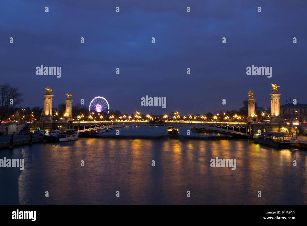 France, Paris, Alexandre III Bridge at night. The Big Wheel in the ...