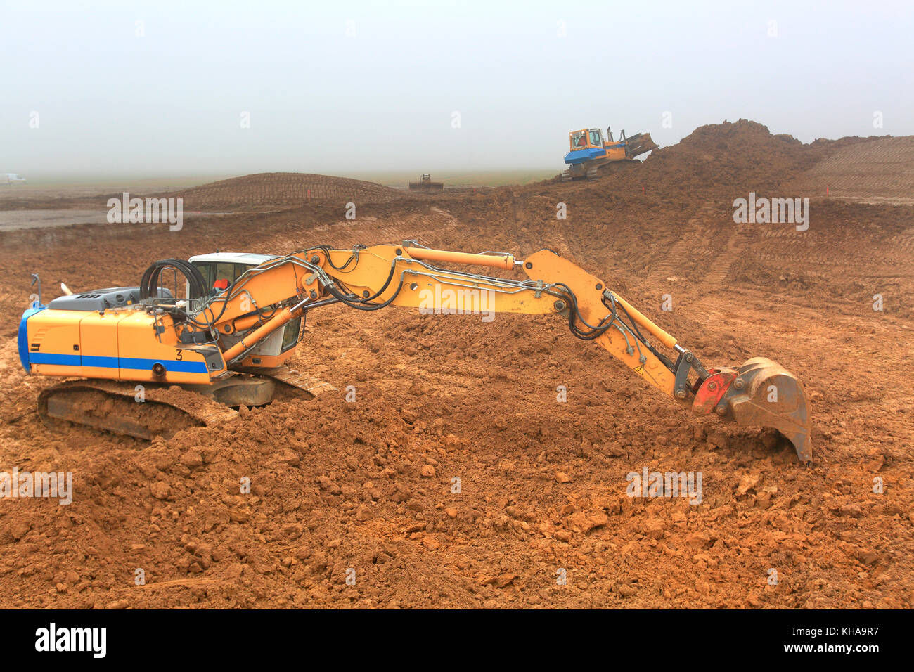 Machines on a building site of earthwork Stock Photo - Alamy