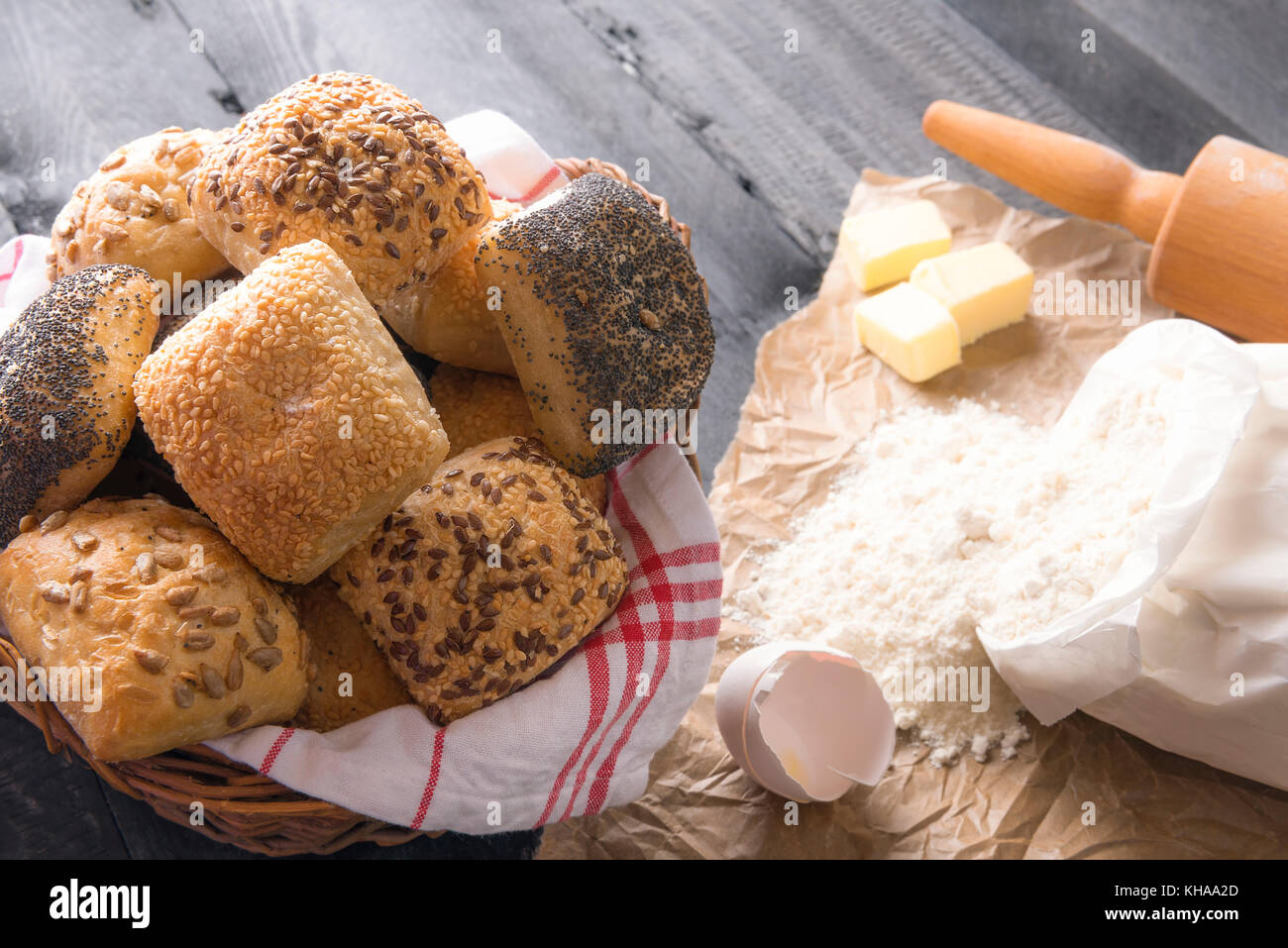 Baking theme image with a bunch of mixed buns, in a wicker basket, with ...