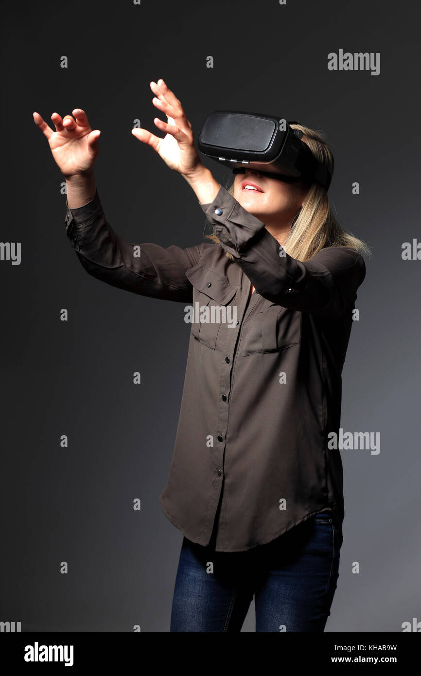 Young female with virtual reality mask Stock Photo - Alamy