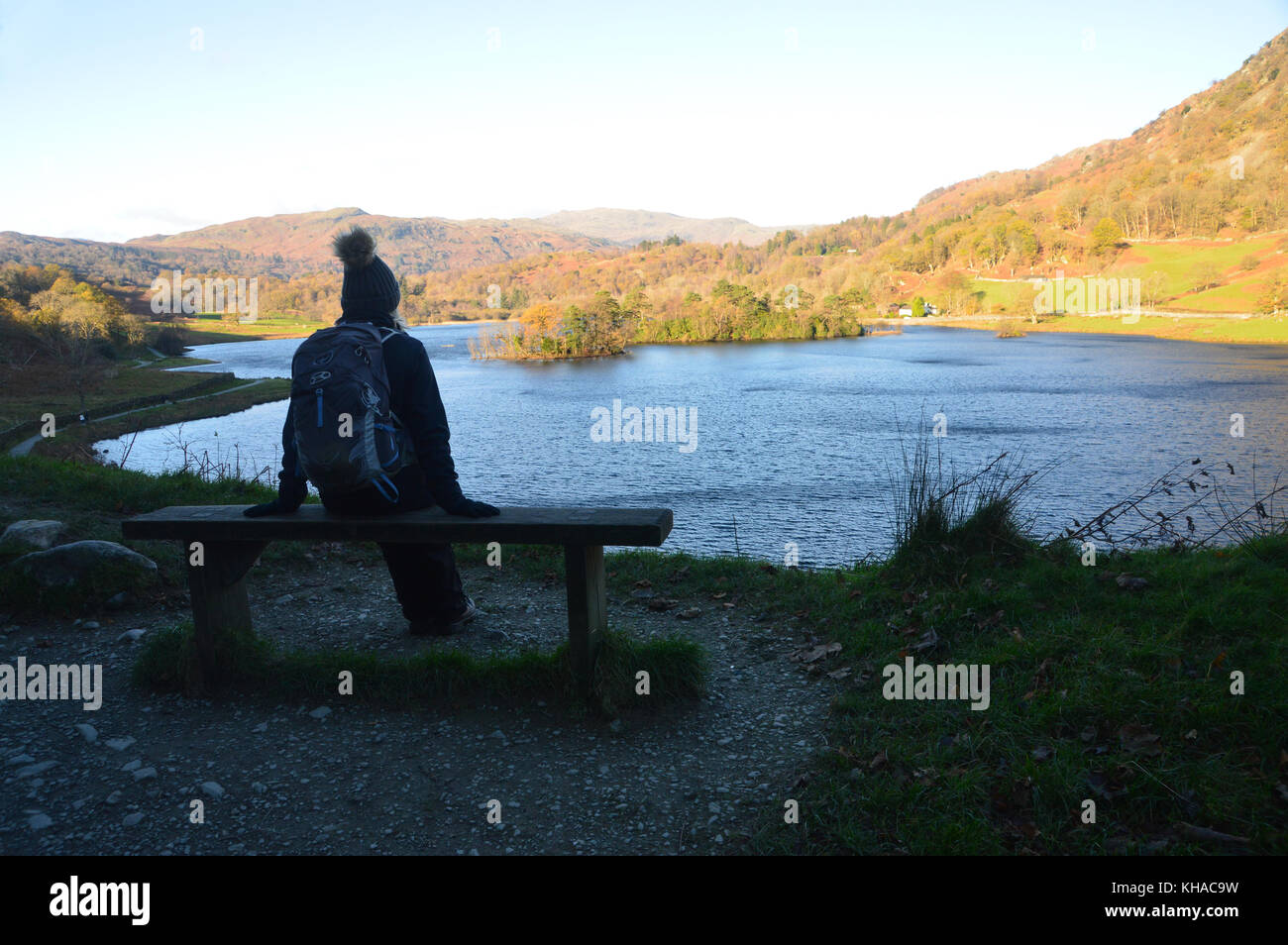 Woman Fell Walker in Bobble Hat Sitting on Wooden Bench Overlooking ...