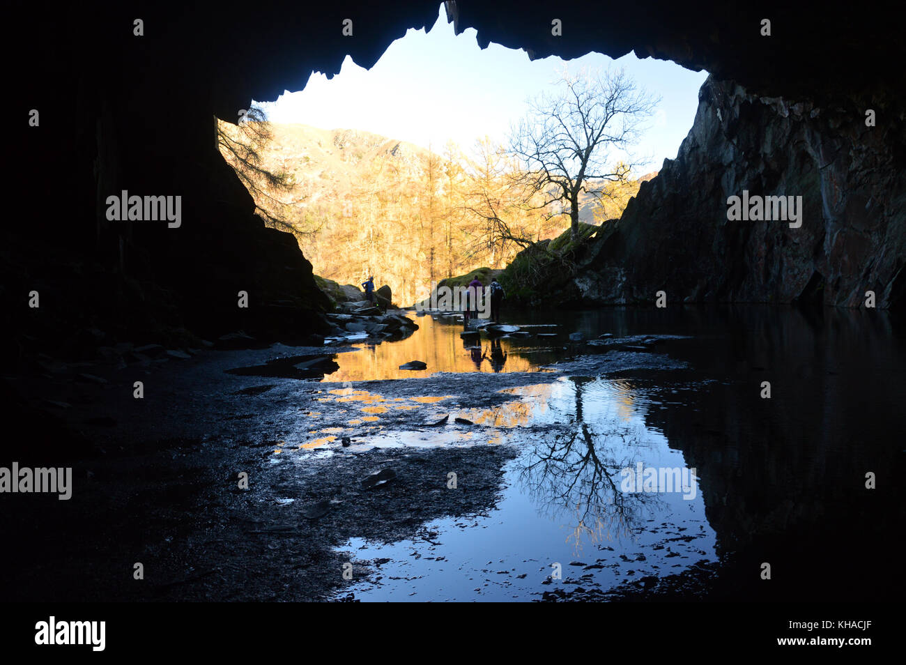 Fell Walkers in Rydal Cave above Rydal Water in the Lake District ...