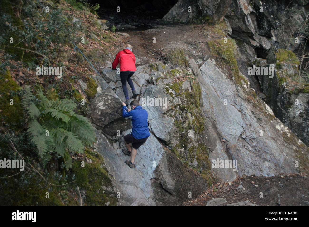 A Couple Climbing Down out of Little Rydal Cave using a Rope above ...