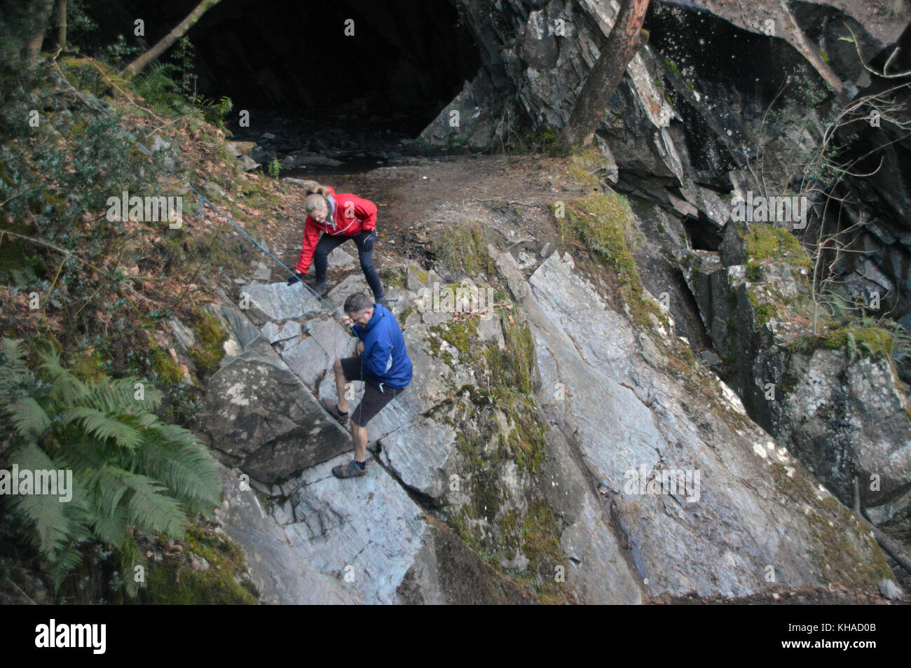A Couple Climbing Down out of Little Rydal Cave using a Rope above ...