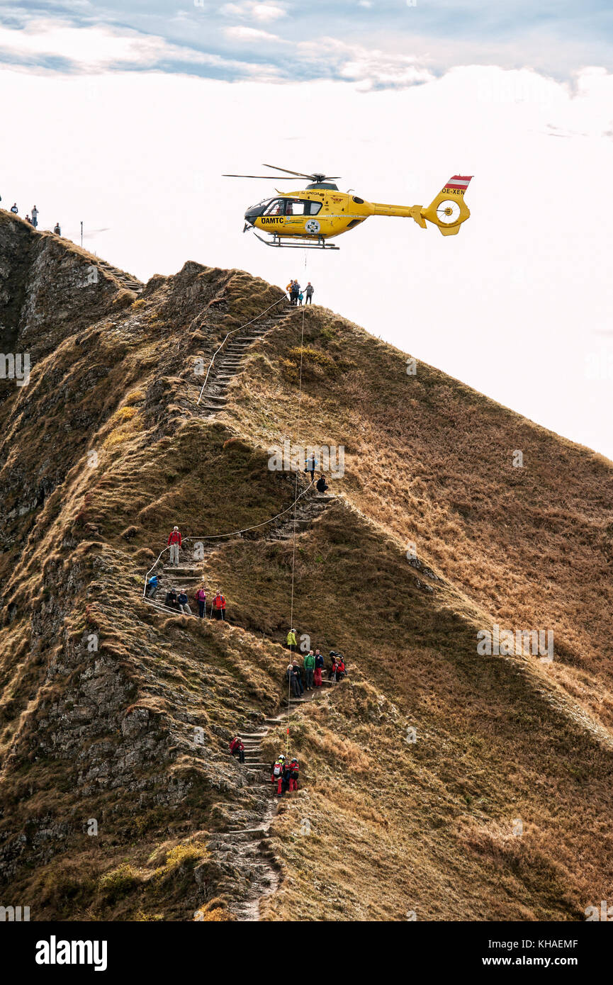 Mountain rescue by helicopter on the Fellhorn ridge, Kleinwalsertal ...