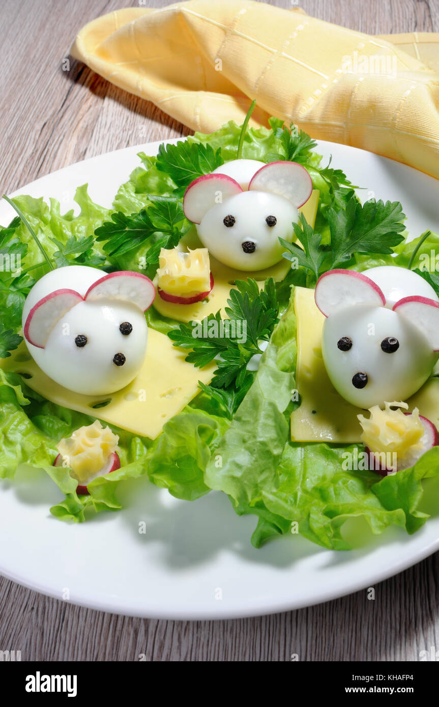 Serving a festive children's snack, boiled eggs in the form of mice in ...