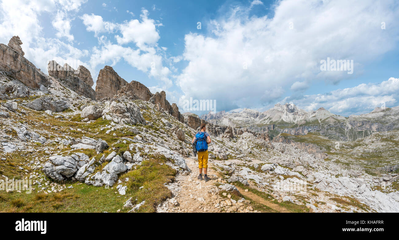 Hikers on the circular trail around the Sella Group, Gardena Pass ...